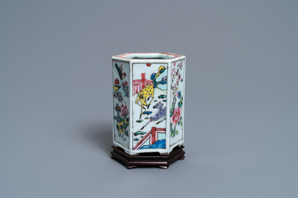 A Chinese hexagonal famille rose brush pot with deer and antiquities ...